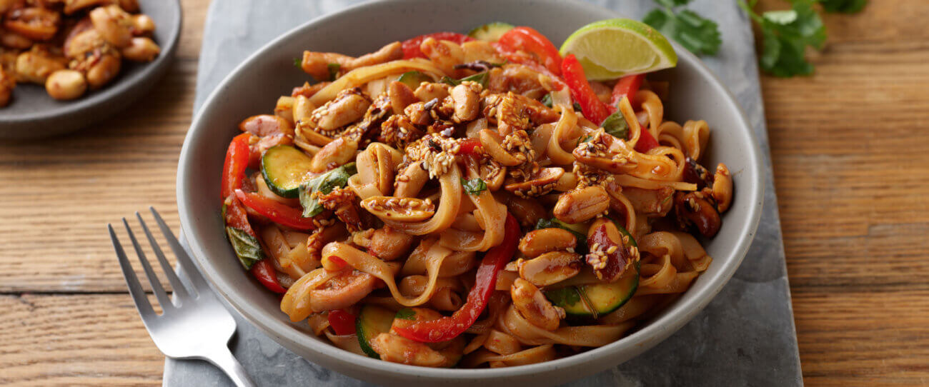 Chicken Noodle Stir Fry with Sesame Peanuts — PLANTERS® Brand